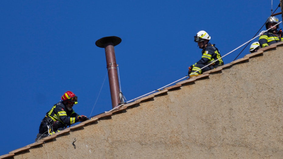 Chimney installed on Sistine Chapel's roof ahead of conclave to pick ...