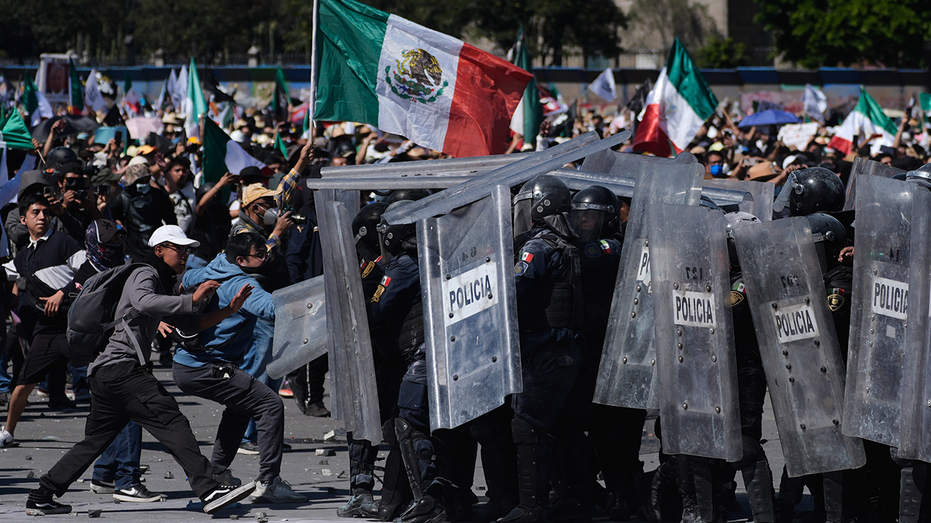 More than 100 officers injured as protesters attack police, breach ...