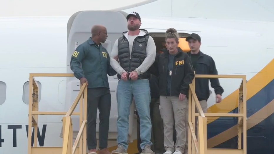 Ex-Olympian Ryan Wedding arrives in US, escorted off plane in cuffs by ...