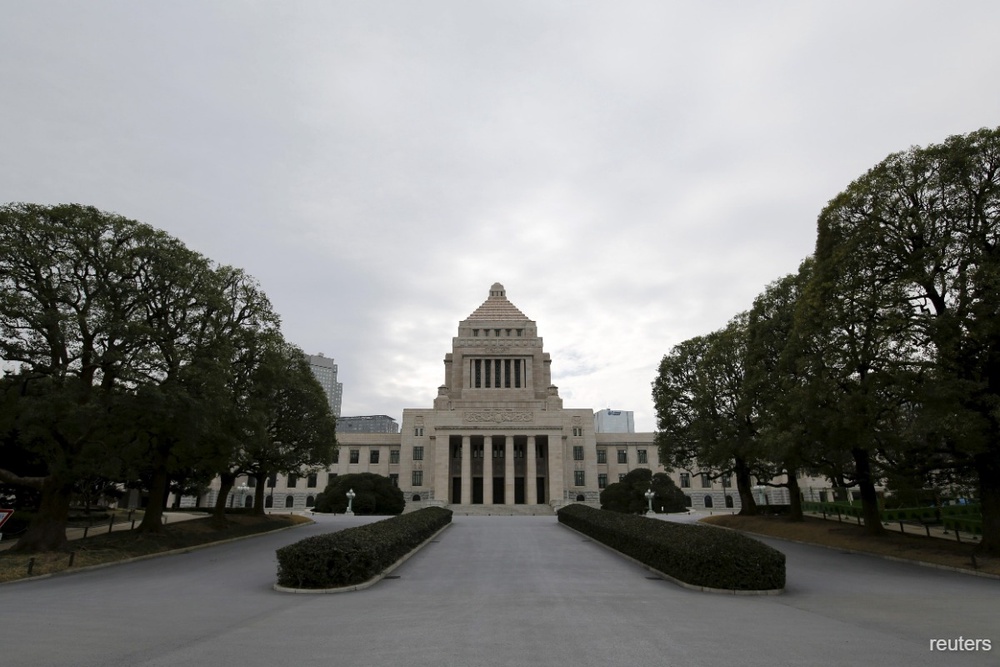Japan's cabinet approves record budget, faces tough parliament fight
