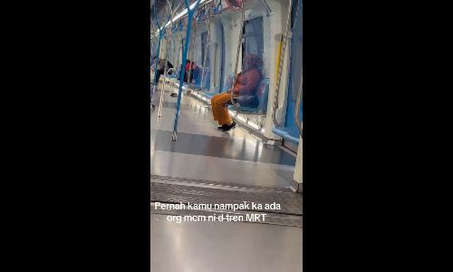 Unusual sight in MRT women’s coach as woman exercises across seats ...