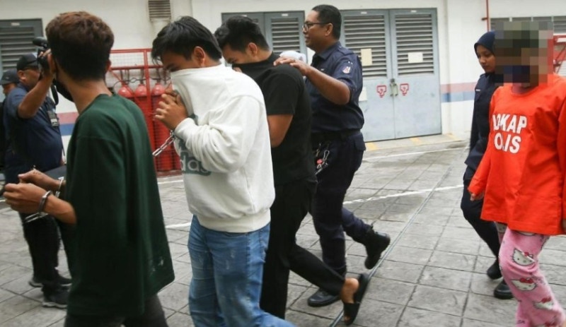 Teen girl among four charged with group robbery at Jelutong condo