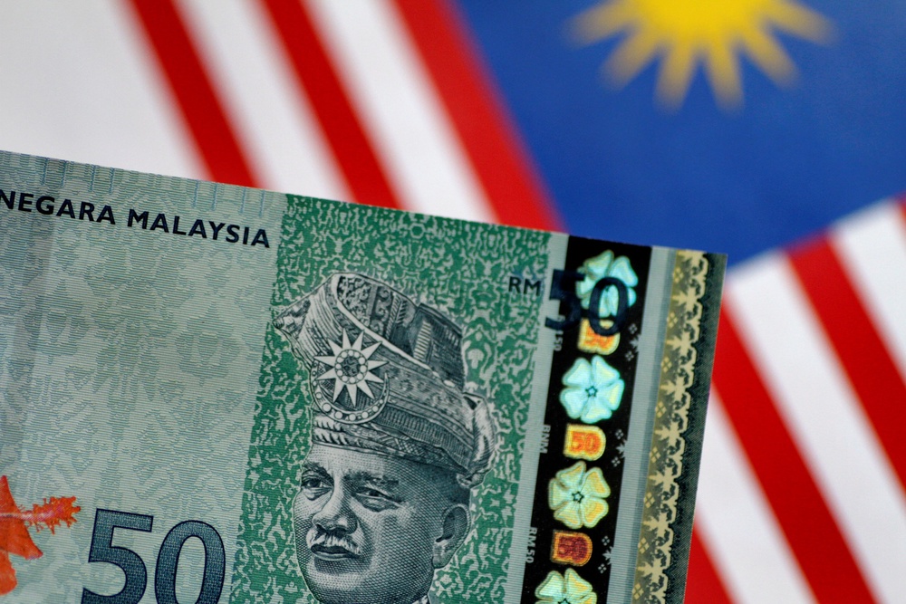 Ringgit ends near one-year high vs US dollar on US Fed cut hopes