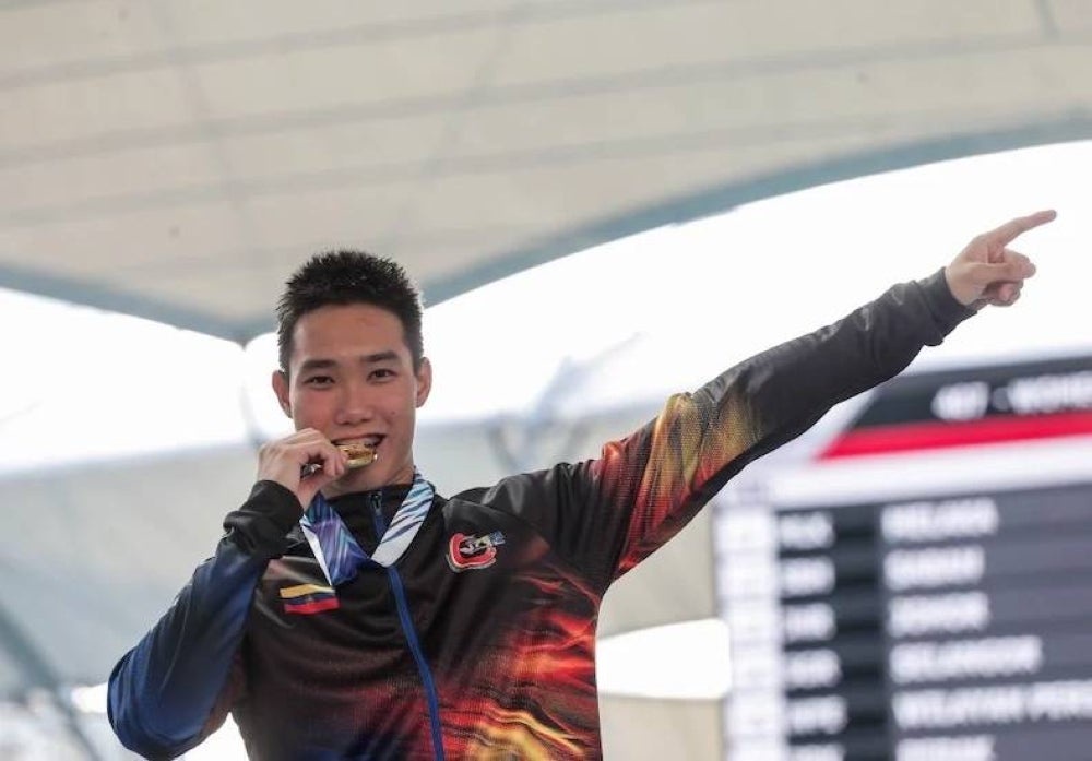 Swimmer Bryan meets qualifying mark for World meet in Fukuoka