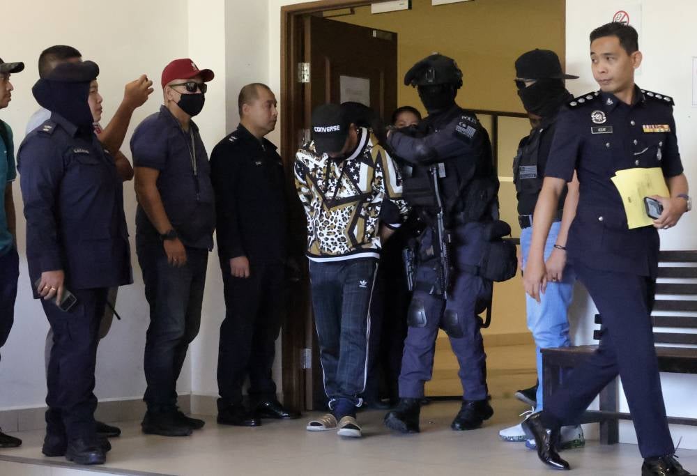 Businessman, 10 others charged with being members of organised crime gang