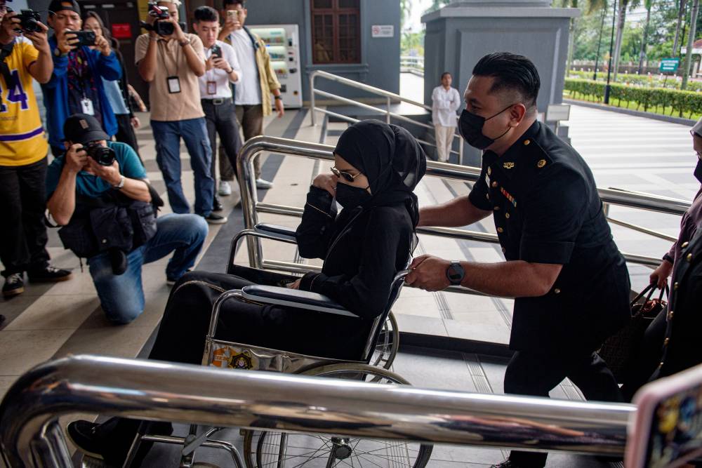 Wife of ex-army chief charged with receiving RM77,000 in proceeds from ...