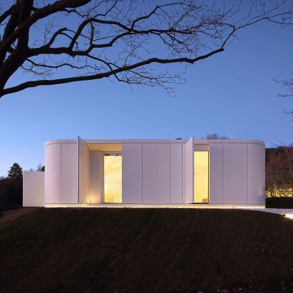 Pinwheel house by JM Architecture resembles "a white pebble in the ...