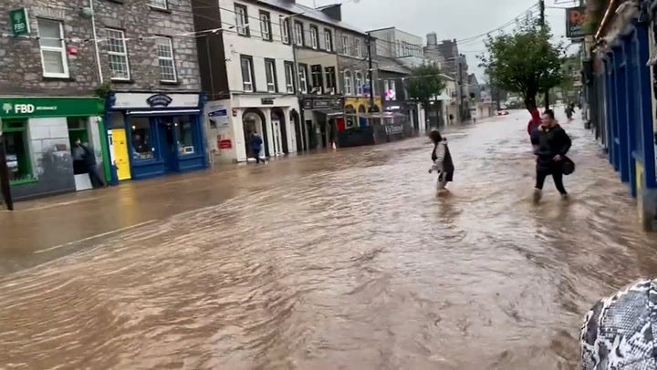 Watch: People wade through flooded streets as Storm Babet brings ...