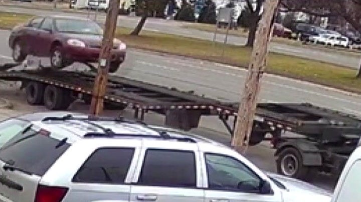 Car launched into air after driving up empty vehicle hauler ramp