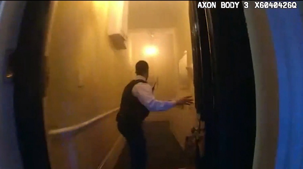 Dramatic Footage Shows Police Kicking Down Door To Rescue People From