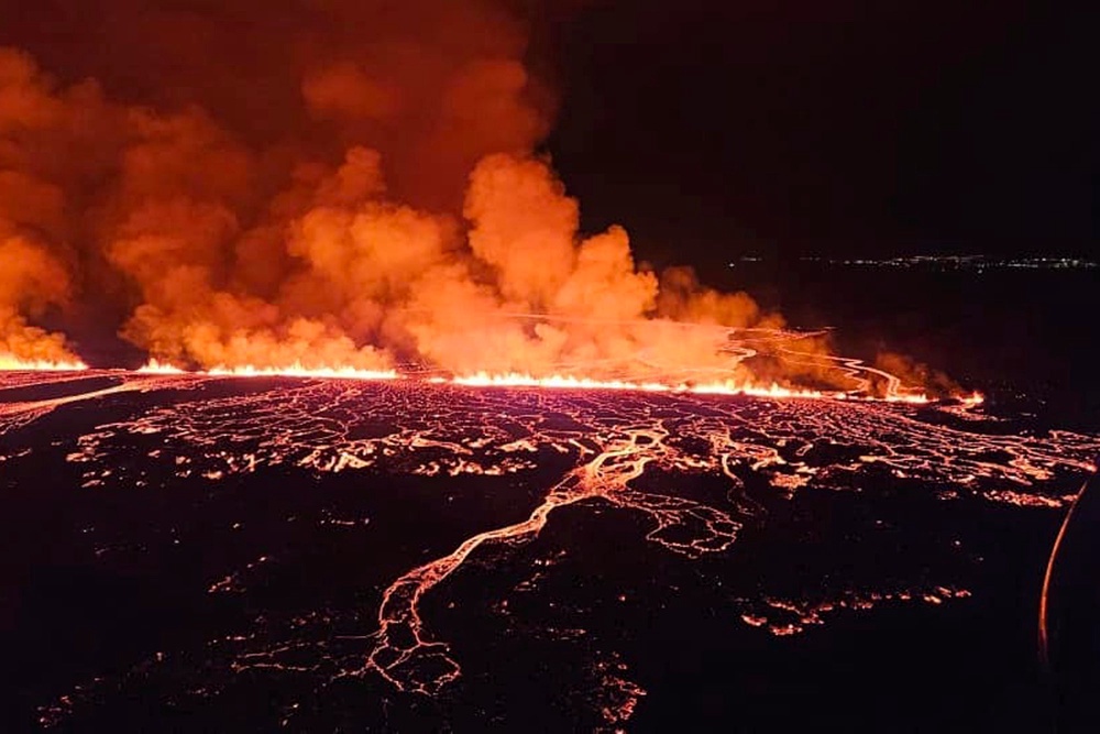 Watch: Fast-travelling molten lava flows metres from Iceland defence ...