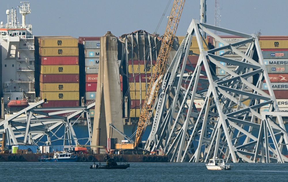 Watch: View of Baltimore bridge wreckage as massive crane arrives for ...