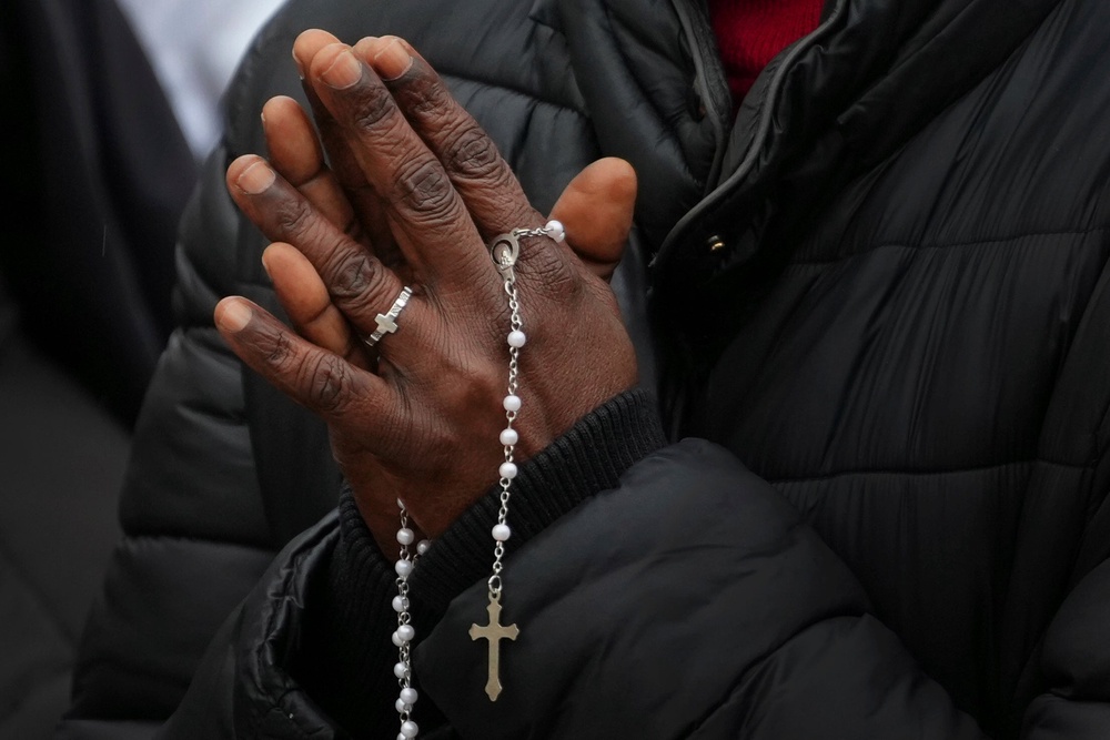 As Pope Francis languishes in hospital, thousands gather to pray the rosary