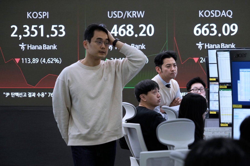 The Latest: Asian markets fall as Trump's tariffs roil global trade