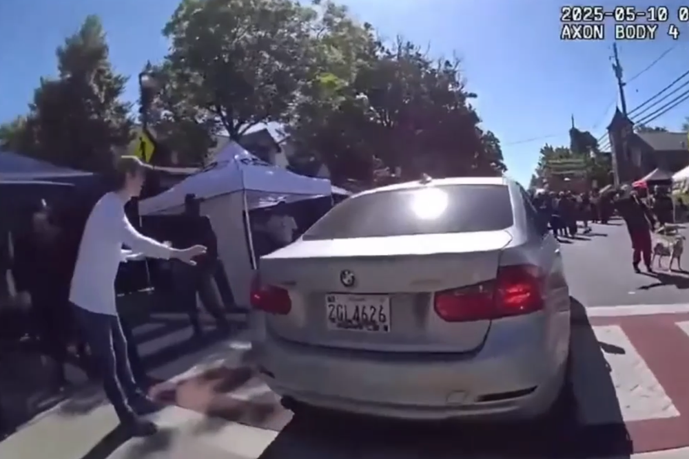 Watch: Woman tries to drive through street festival to get to work