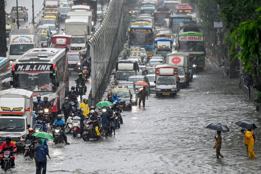 Storms kill 14 in Pakistan and flooding sparks chaos in Mumbai as early ...
