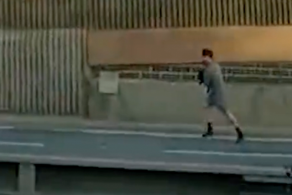 Watch: Dramatic moment police chase suspect down dual carriageway on foot