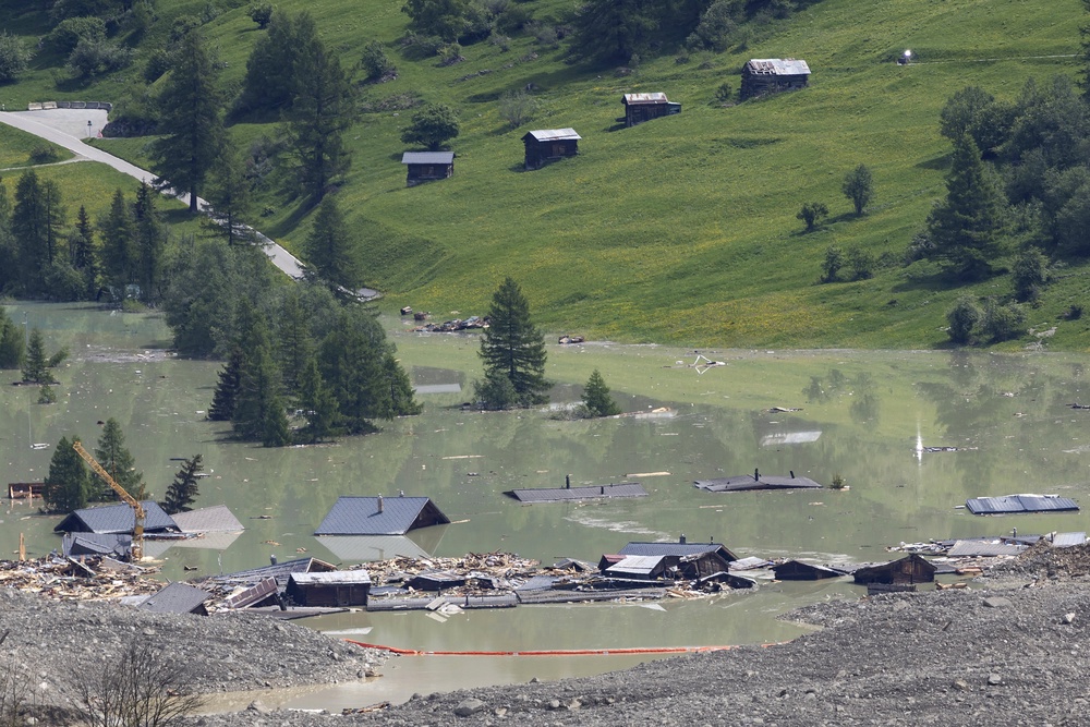 Flooding fears eased at picturesque Swiss Alpine village buried by ...