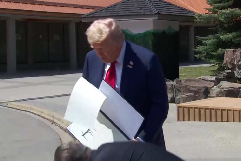 Donald Trump accidentally drops signed US-UK trade deal document