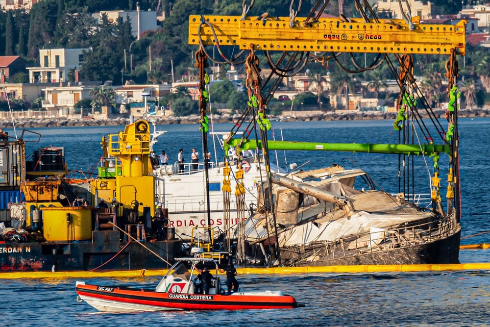 Sunken Bayesian superyacht lifted out of the water off Sicily as ...