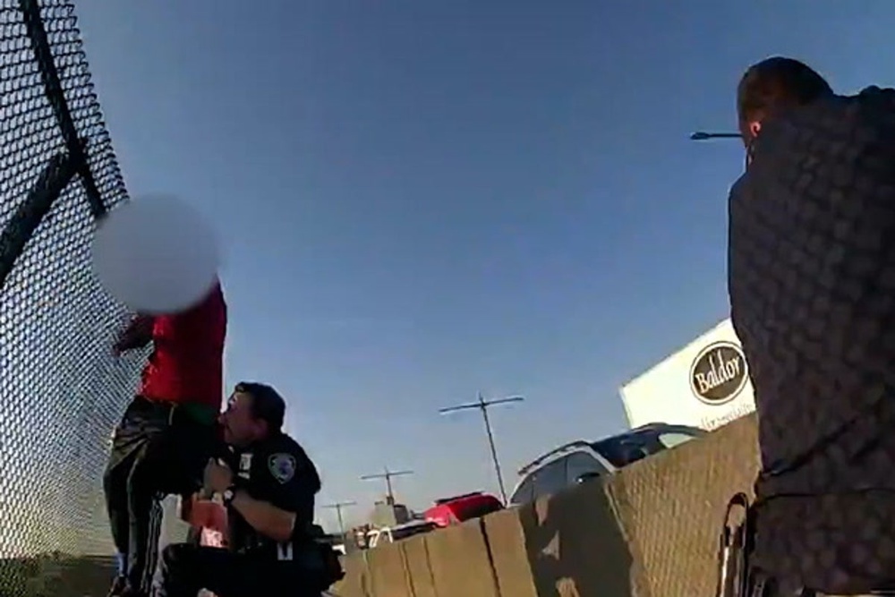 Tense scene as NYPD officer grabs woman attempting bridge jump