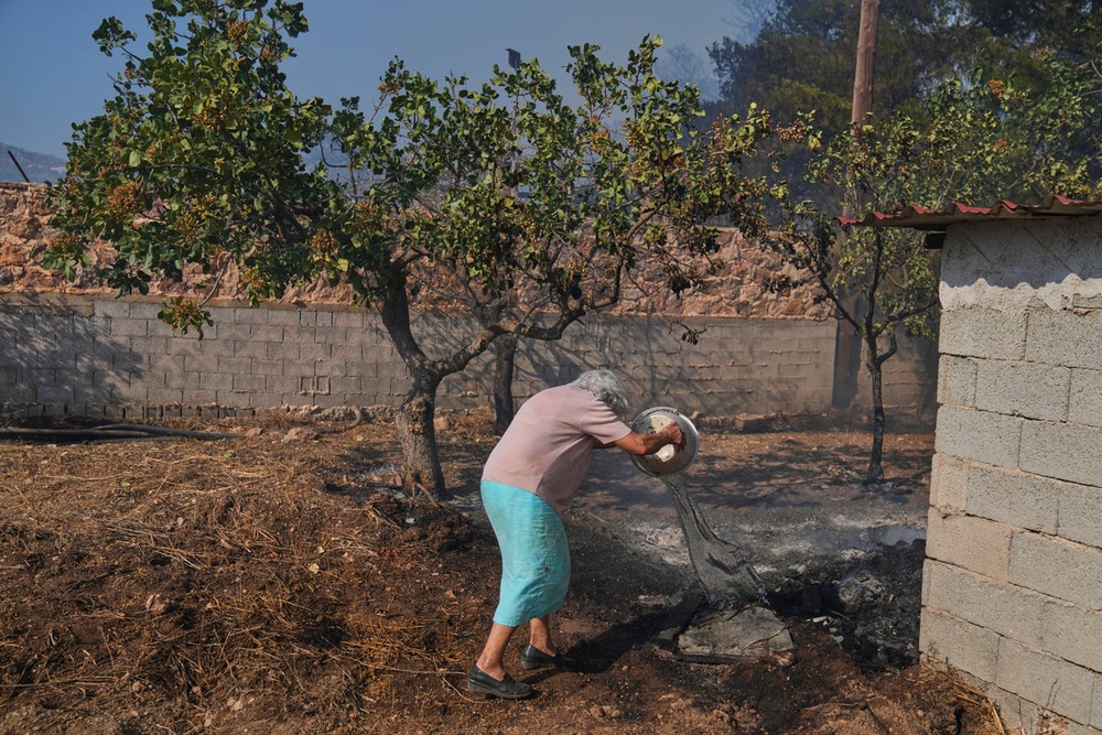 Photos of burning wildfires in Greece