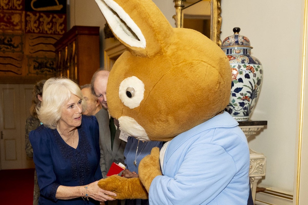 Queen meets Peter Rabbit as she wishes reading charity ‘happy 100th ...