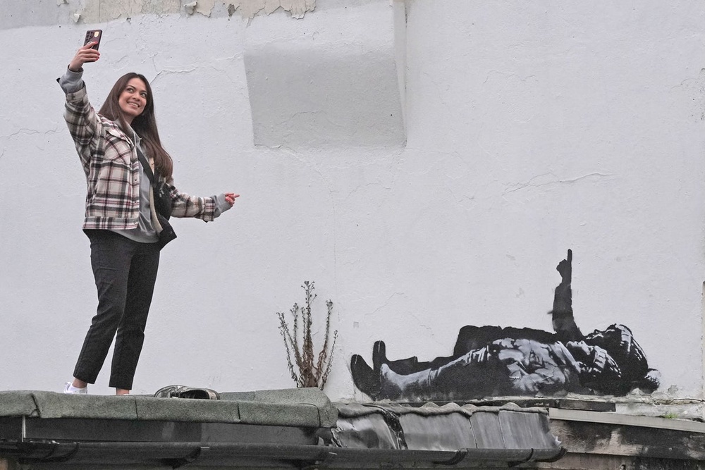 Banksy claims Bayswater artwork that shows two figures lying down