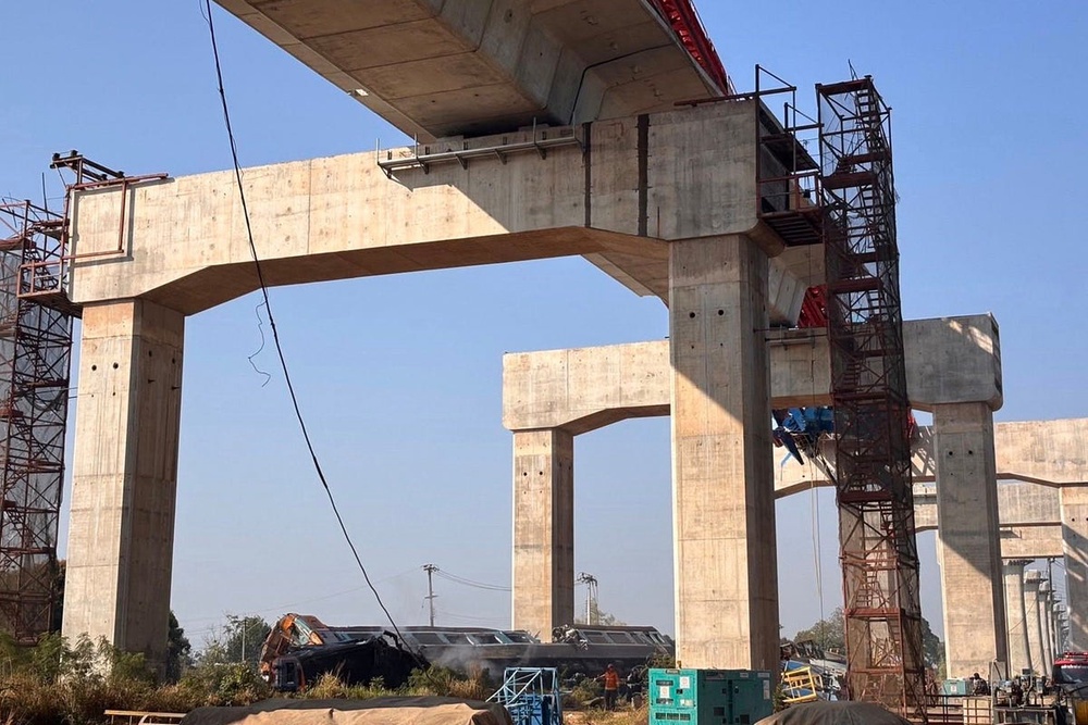 A construction crane falls on a passenger train in northeastern ...