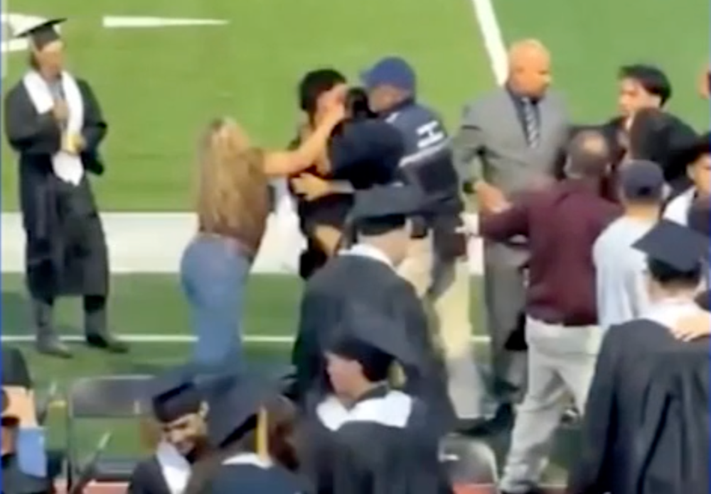 Wild brawl breaks out between cap-and-gown-wearing seniors as names are ...