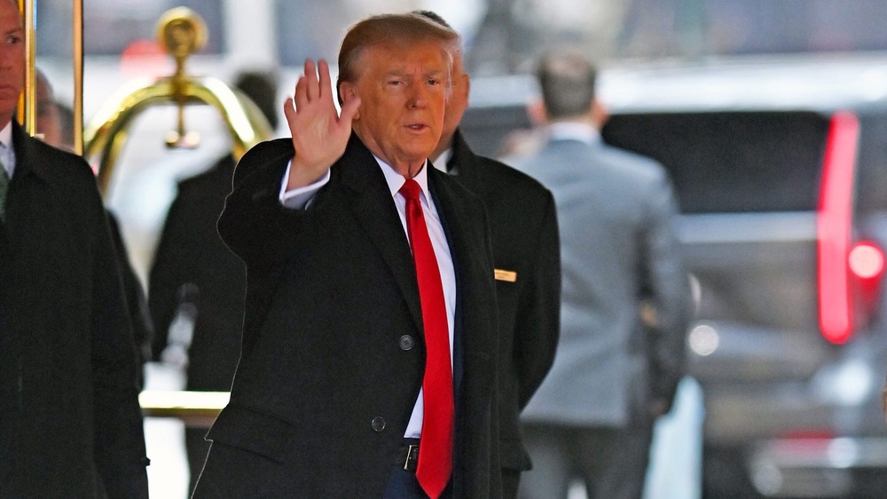 Trump says red marks on hands may have been AI