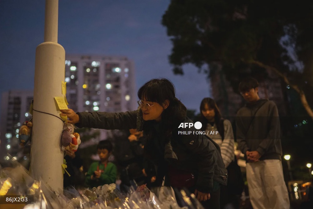 Hong Kong mourns 128 killed in deadly residential tower fire