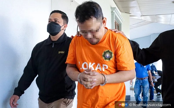 ‘Datuk Roy’ brought to court ahead of remand in Jana Wibawa graft ...