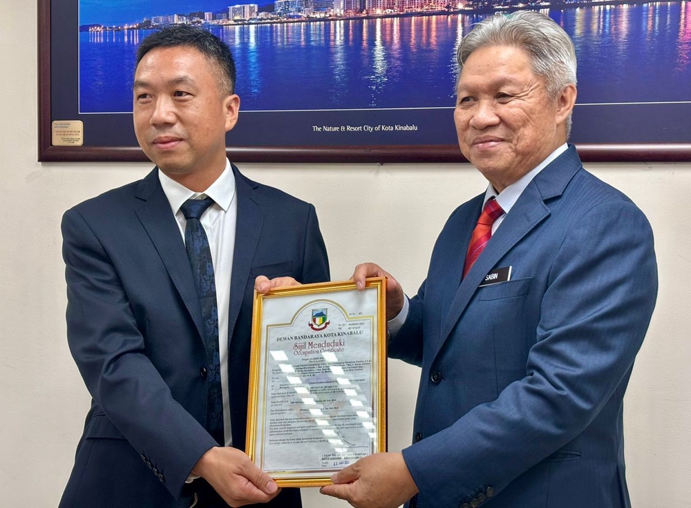 DBKK hands over Occupation Certificate to Kibing