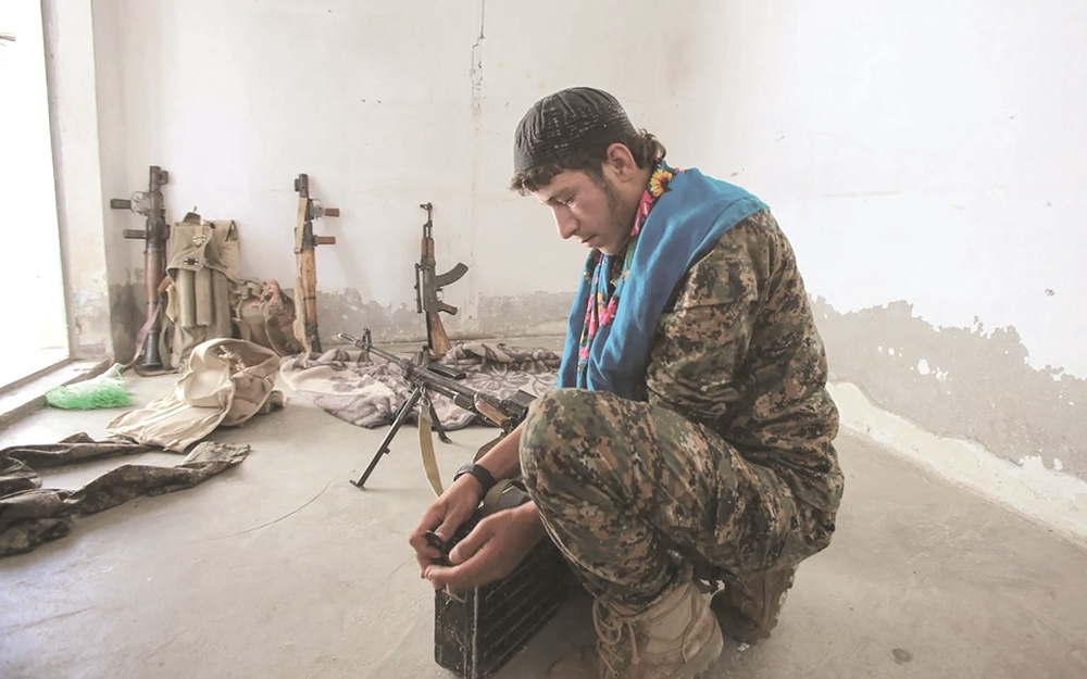 Turning point as Kurdish fighters destroy weapons