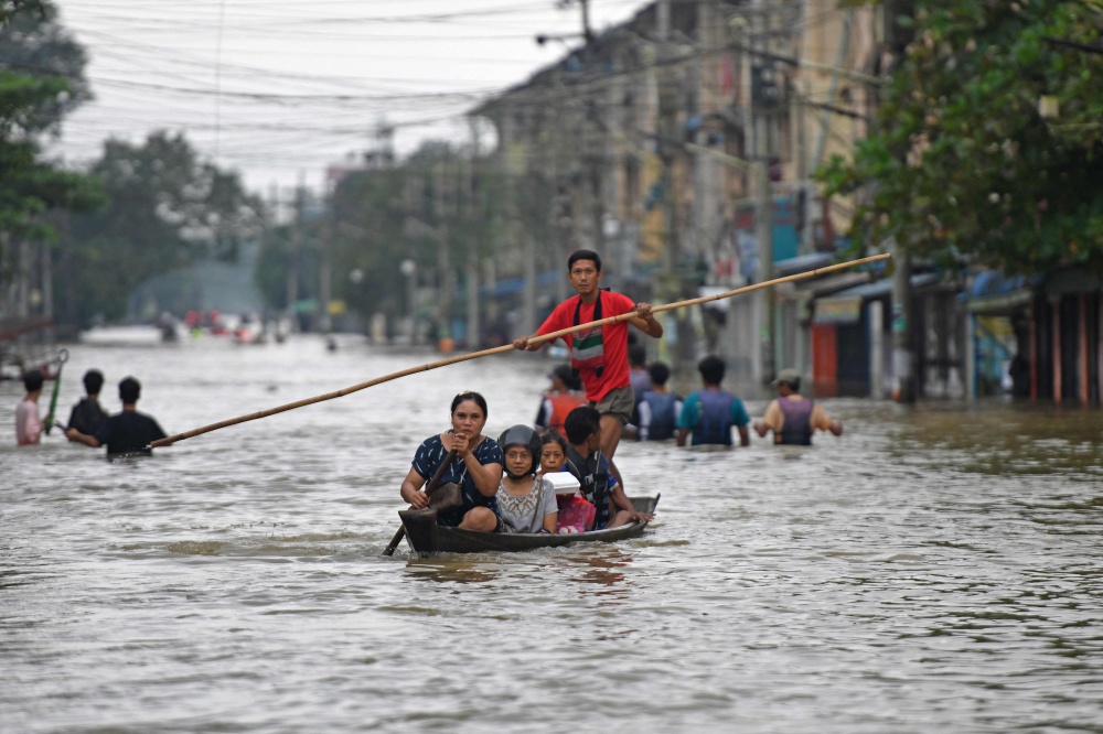 Record rain sparks floods in Myanmar, displaces 14,000