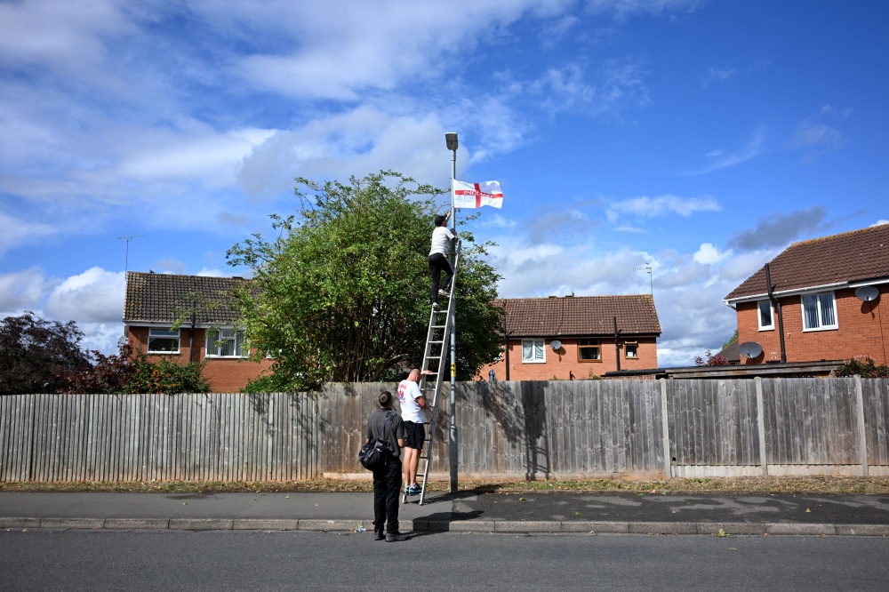 Symbol of unity or division? Why English flags are flooding towns and ...