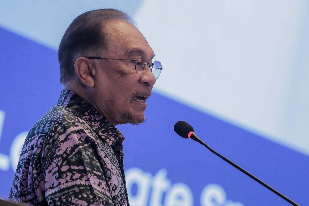 PM Anwar to visit Sabah landslide and flood victims after 14 deaths ...