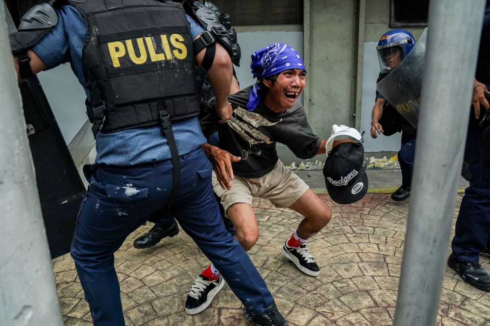 Philippine police clash with protesters, arrest over 200 amid flood ...