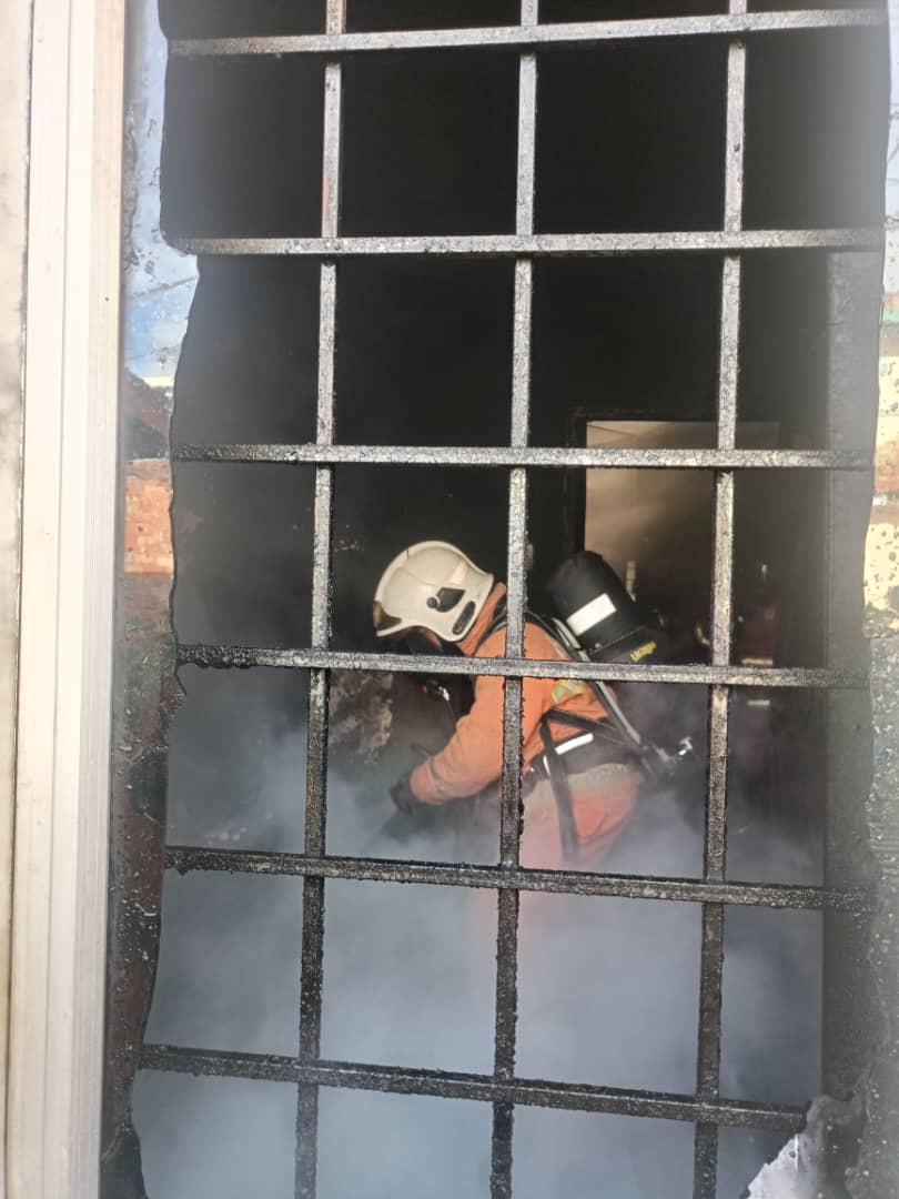 Woman suffers minor burns on back after house fire