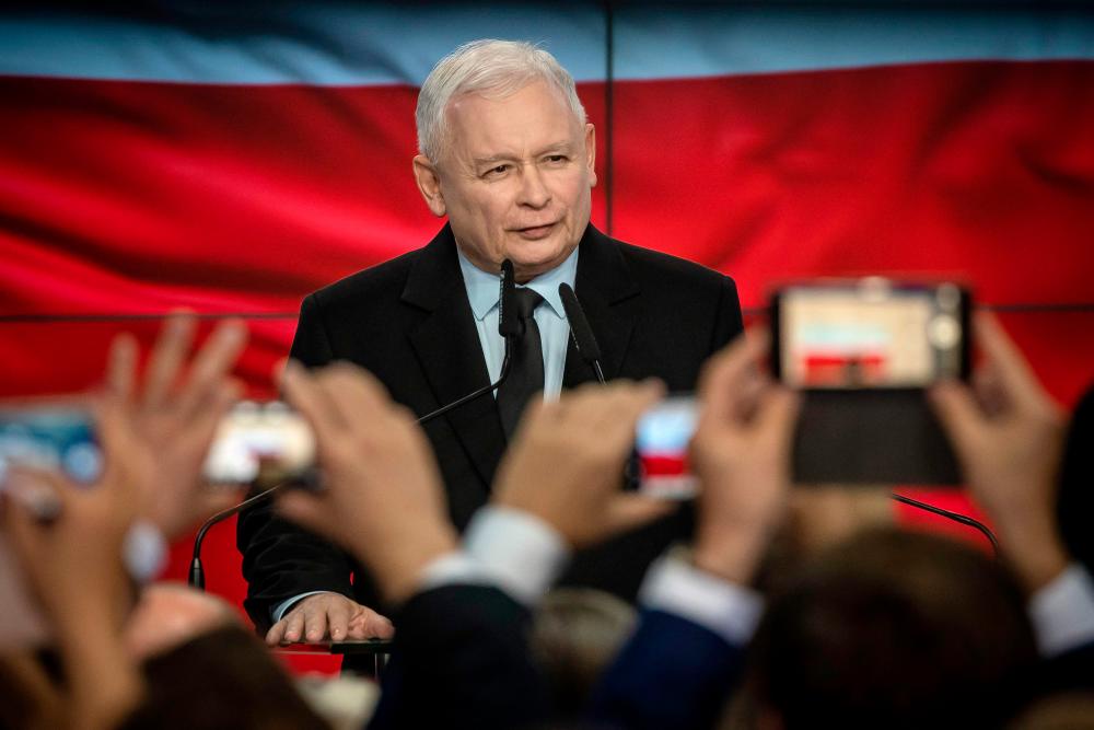 Polish ruling party leader returns to govt ahead of election campaign Polish ruling party leader returns to govt ahead of election campaign