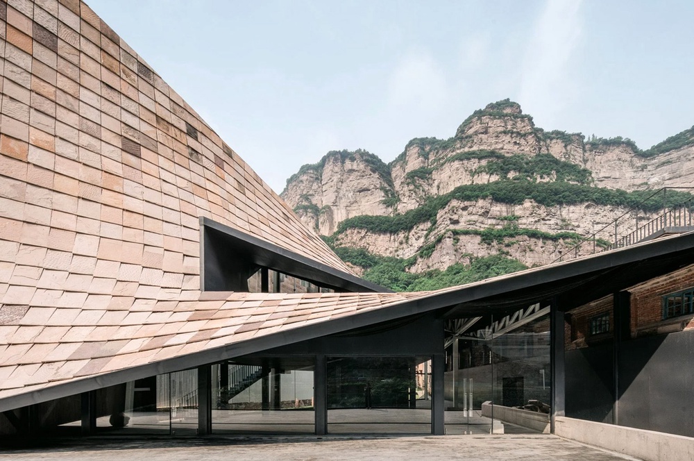 Sculptural sloping roof was added to an art museum in China to help it ...