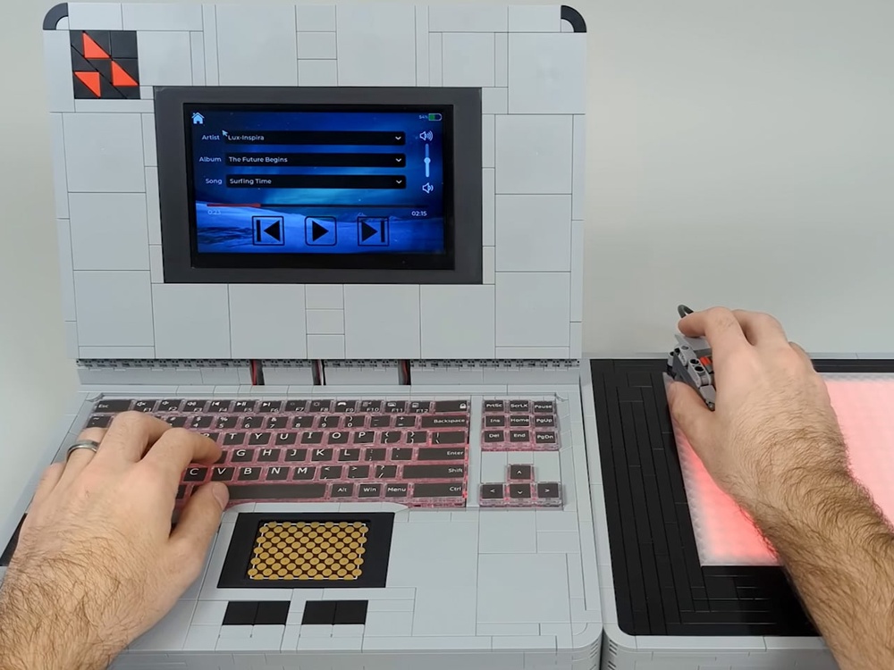 3D-printed LEGO laptop with a biometric authenticator, touchscreen ...