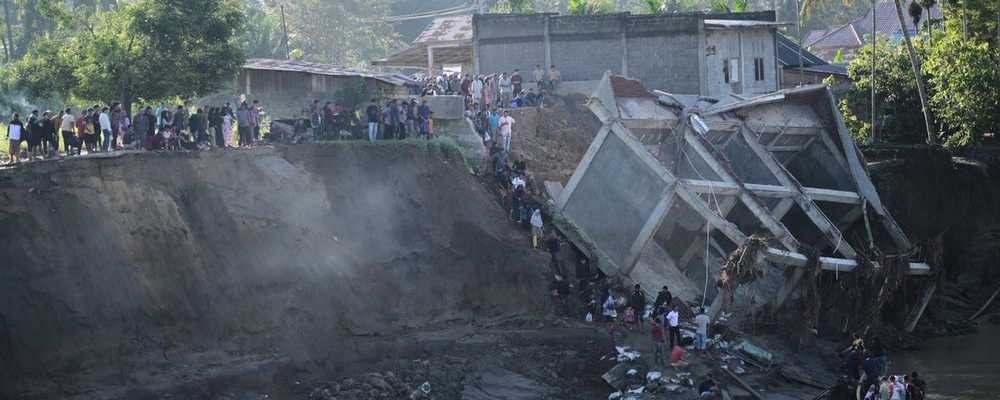 Death toll from floods and landslides on Indonesian island hit 248