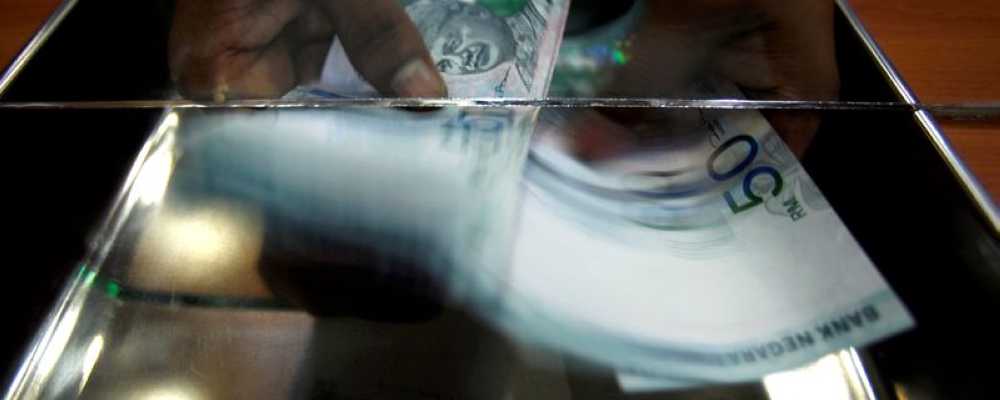 Ringgit nudges higher against US dollar as Malaysia awaits Q4 GDP figures