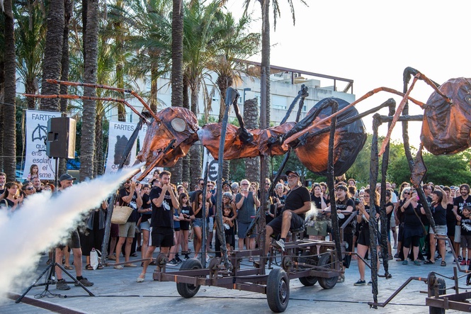 Giant ant puppets swarm streets of Spanish island in anti-tourism ...
